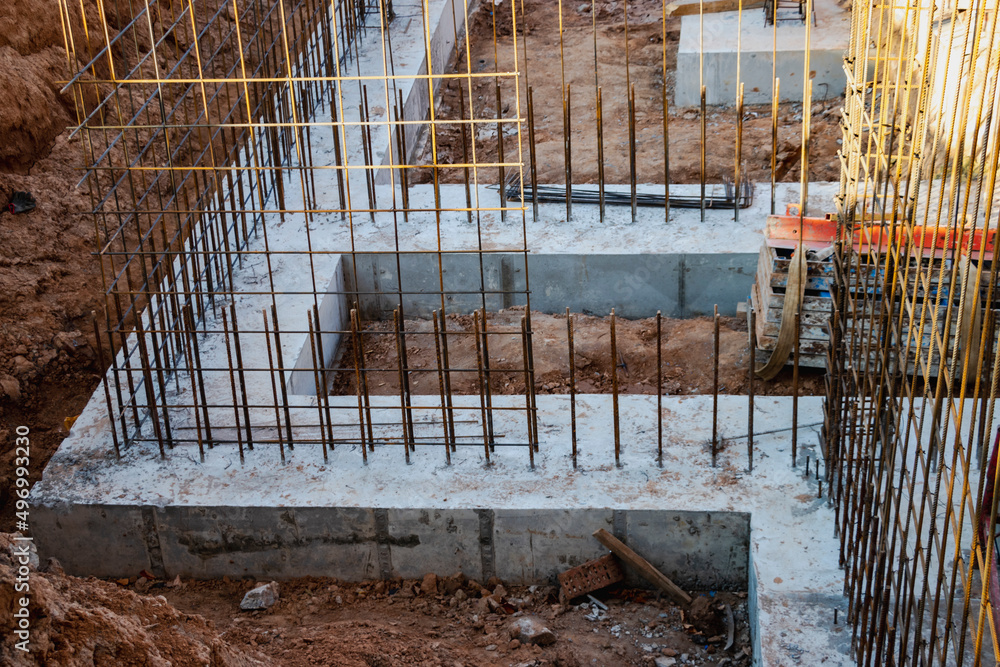 Monolithic foundation with metal reinforcement. Forms vertical formwork ...