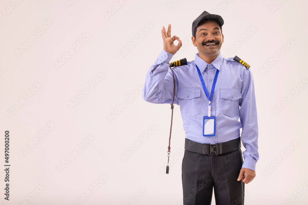 Portrait of security guard gesturing with his fingers Stock Photo ...