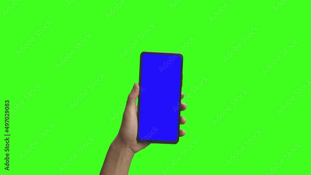 Tablet in the hand close up isolated at green background. Tablet screen ...