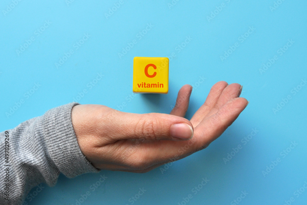 Vitamin C in your hand. Lack of vitamin C in the human body Stock Photo ...