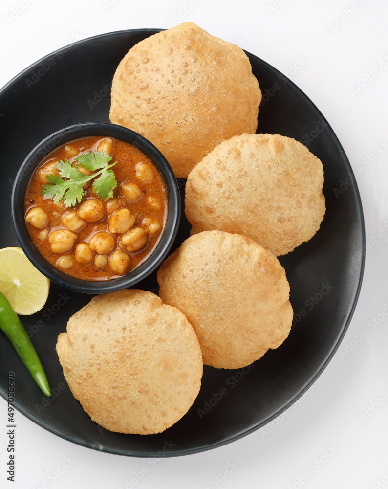 Puri and Chole traditional Indian food Indian dish spicy Chick Peas ...
