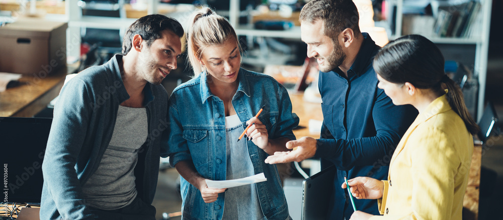Startup and millenial business concept. Group of managers discussing ...