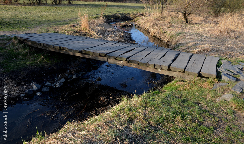 floating walkway made of wooden planks, pier, narrow curved paths on ...