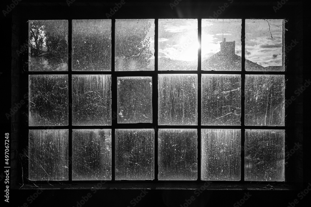 Dirty window in abandoned factory with sun shining through Stock Photo ...