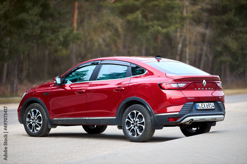Berlin - March 2022: 2021 Renault Arkana e-Tech hybrid SUV car three ...