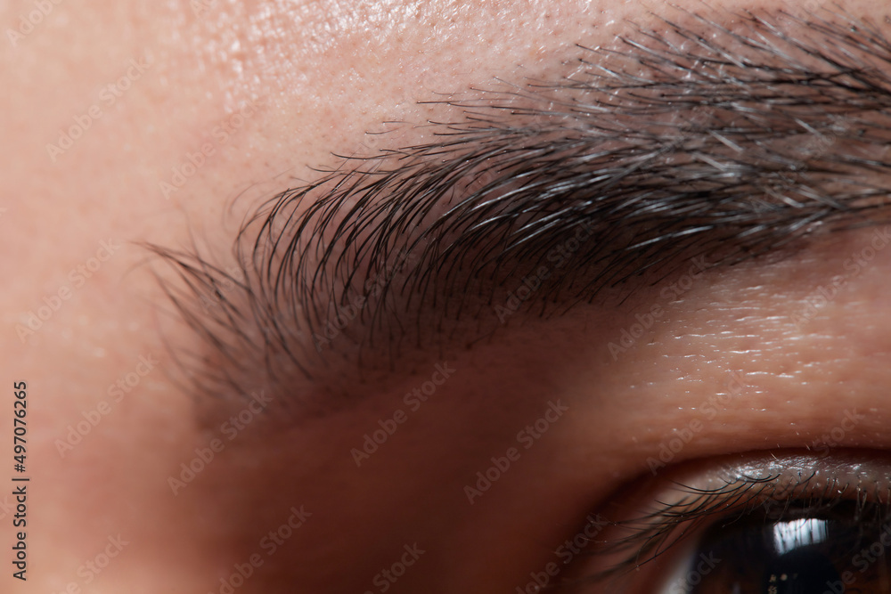 Professional barber doing threading procedure and correcting shape of ...