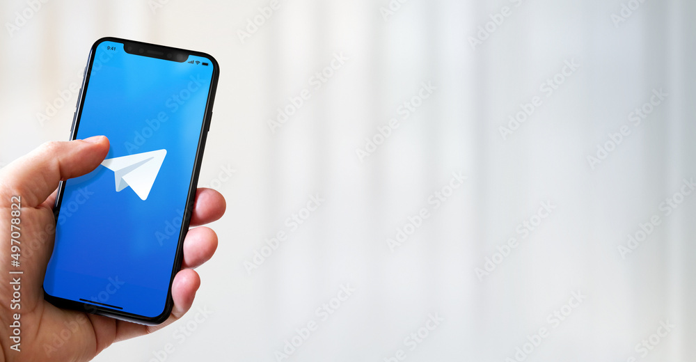 Hand holding iphone smartphone with Telegram logo, Paris, France Stock ...