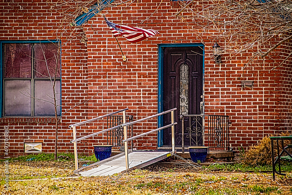 Poster Metal handicap ramp built out from front porch of brick house ...