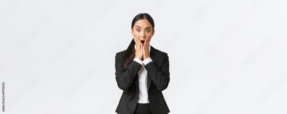 Shocked concerned asian businesswoman facing troublesome situation ...