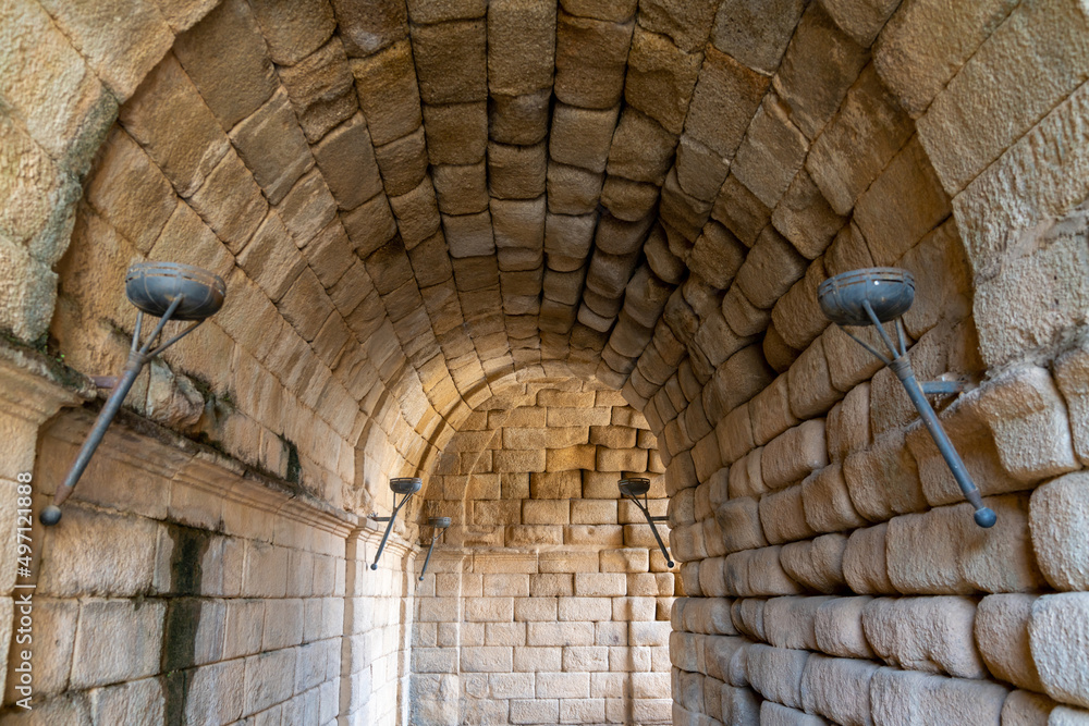 stone hallway in the Roman amphitheater of Merida that led gladiators ...