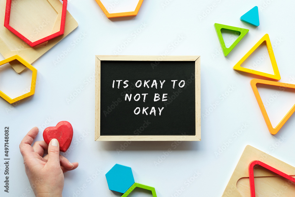 Text Its okey to not be okey on blackboard, chalk board. Nested wood ...