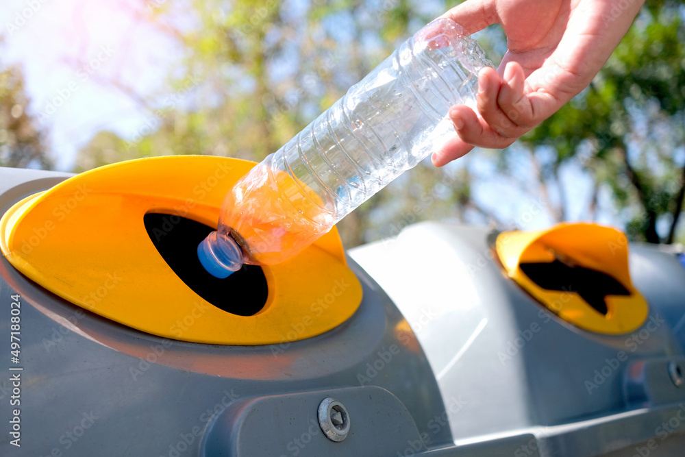 Please dispose of plastic bottle into the tank. A man throw rubbish in ...