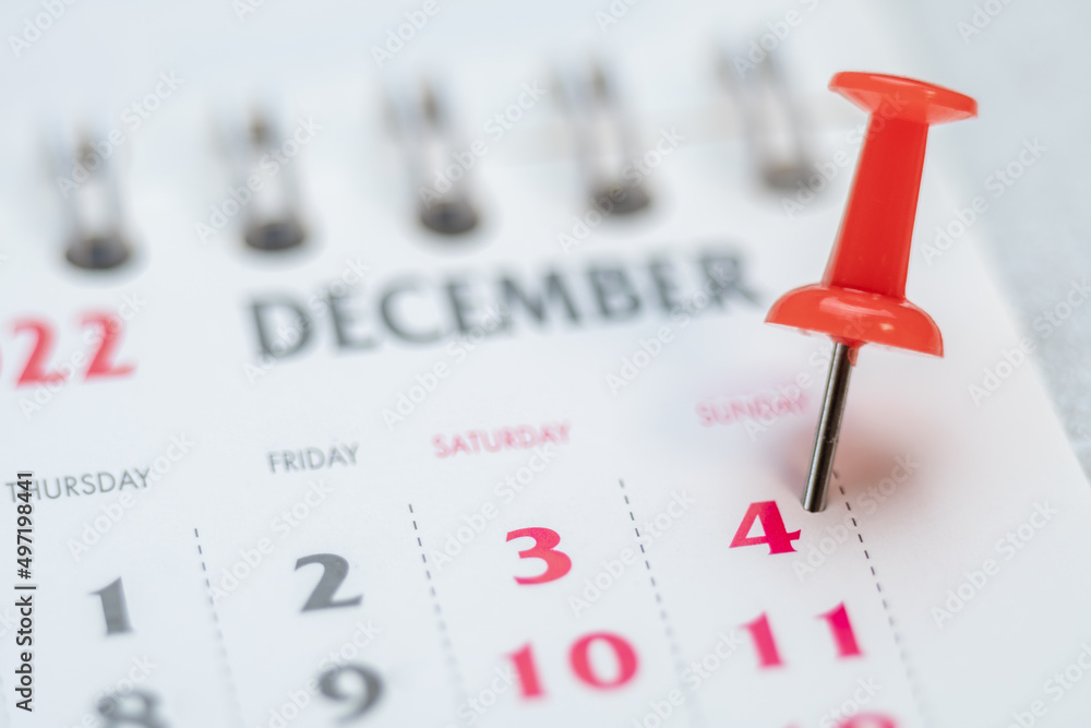 Red push pin on calendar 4th day of the month, mark the Event day with ...