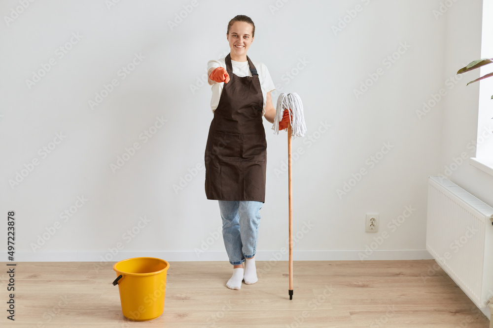 Hey you, choose our cleaning service. Full length portrait of smiling ...