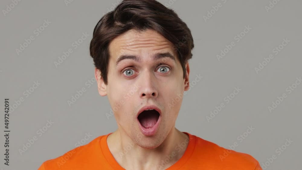 Close up shocked surprised stupefied young brunet man 20s years old ...