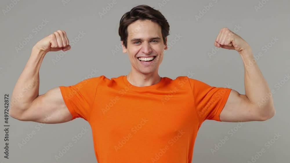 Strong sporty fitness smiling young brunet man 20s years old wears ...