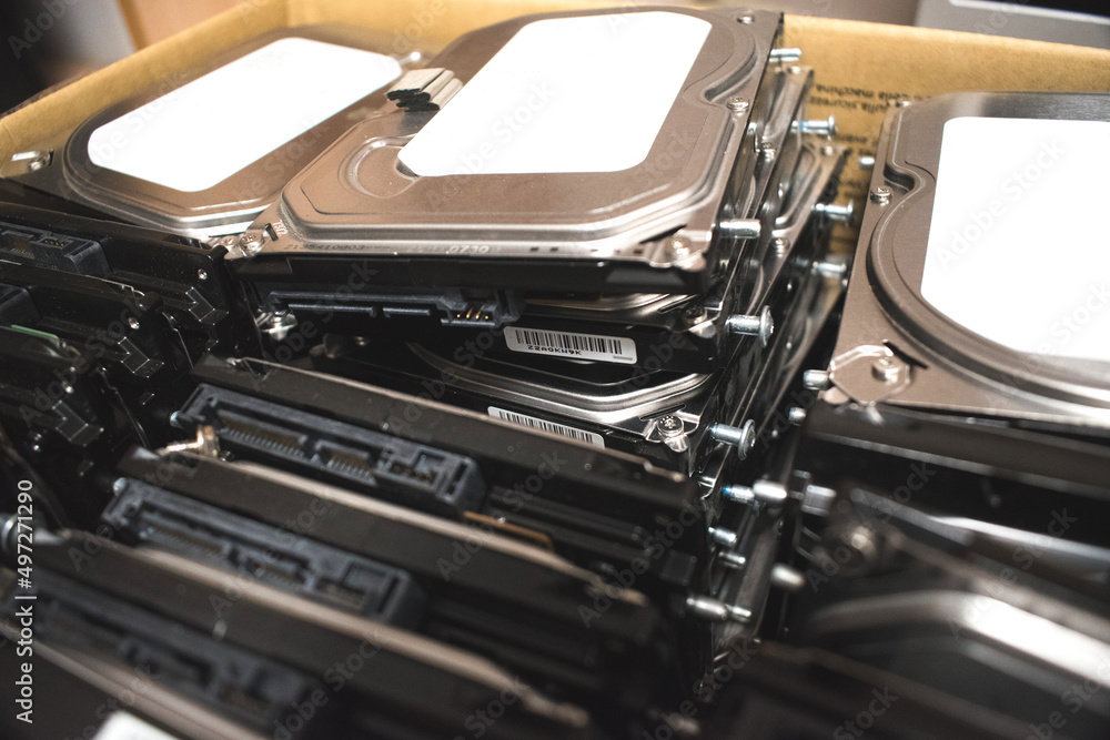 Neatly stacked mechanical hard drives inside a cardboard box Stock ...