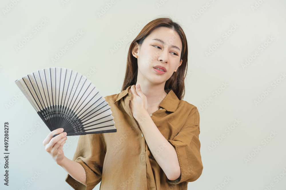 Suffering summer heat stroke, hot weather, tired asian young woman ...