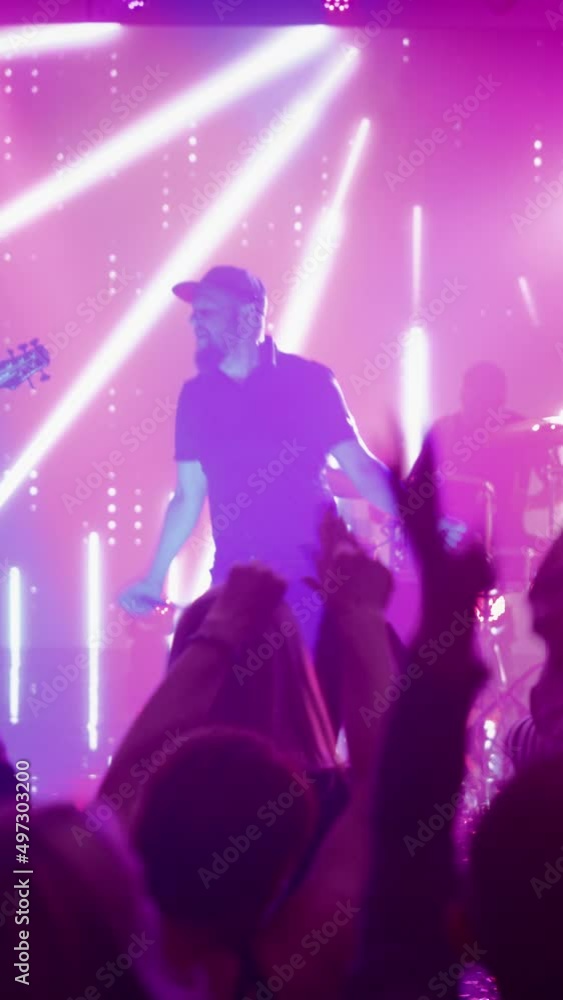 Vertical Footage of Rock Band Performing at a Concert in a Night Club ...