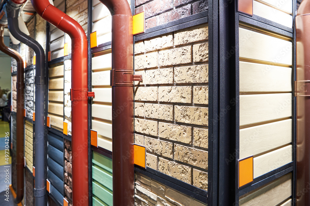 Samples of wall coatings, panels and downpipes at store Stock Photo ...
