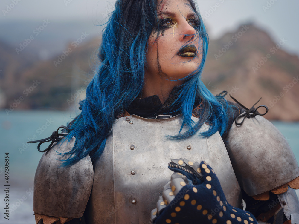 Medieval knight woman in armor prays, blessing before the battle. Stock ...