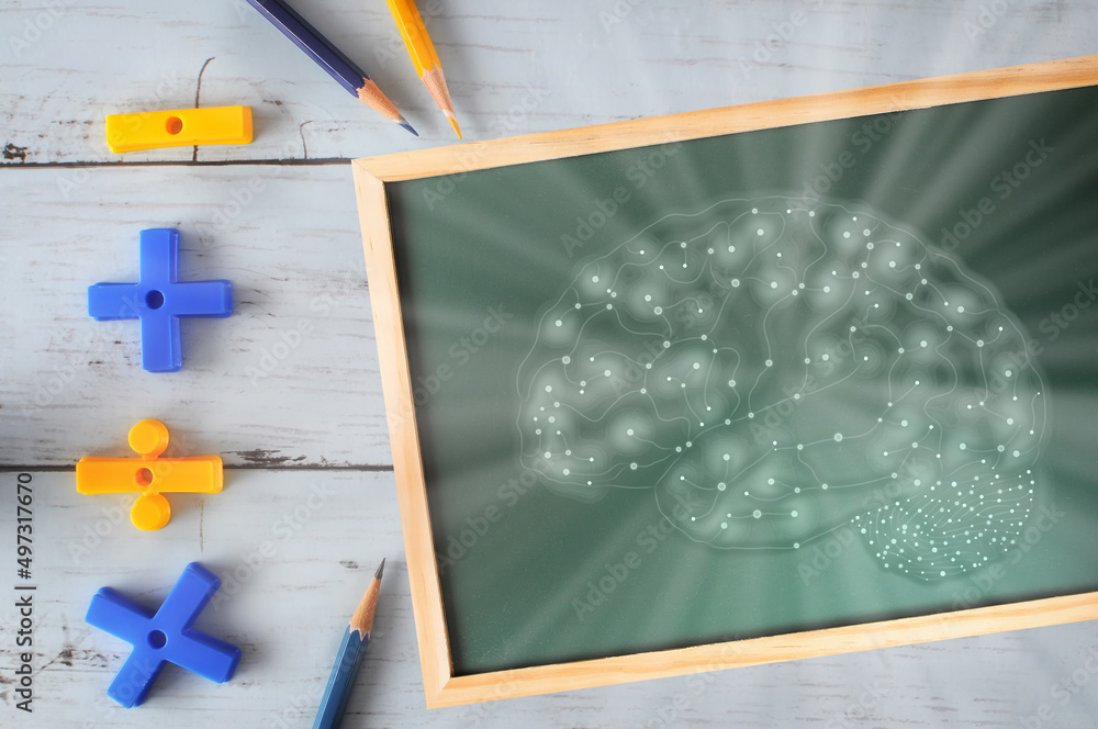 Brain drawing on chalkboard with mathematics symbol and colored pencil ...