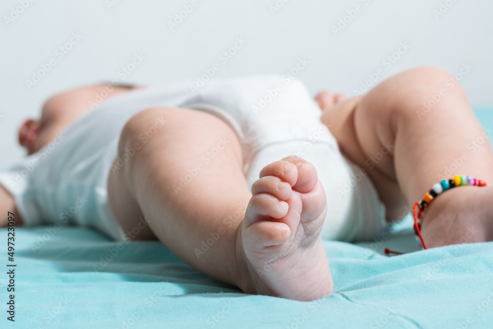 beautiful and tender feet of a two months old baby girl, with her ...