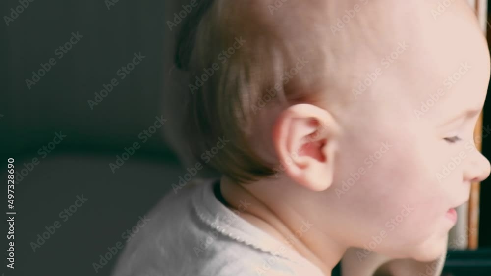 Serious baby face close up. Pensive Baby child in daylight. Emotion of ...