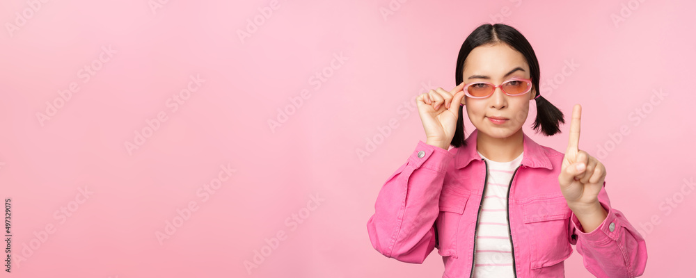 Image of asian girl with serious face, showing prohibit, scolding ...