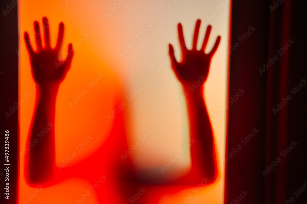 Ghost shadow of hand behind frosted glass, Violence, fear, horror ...