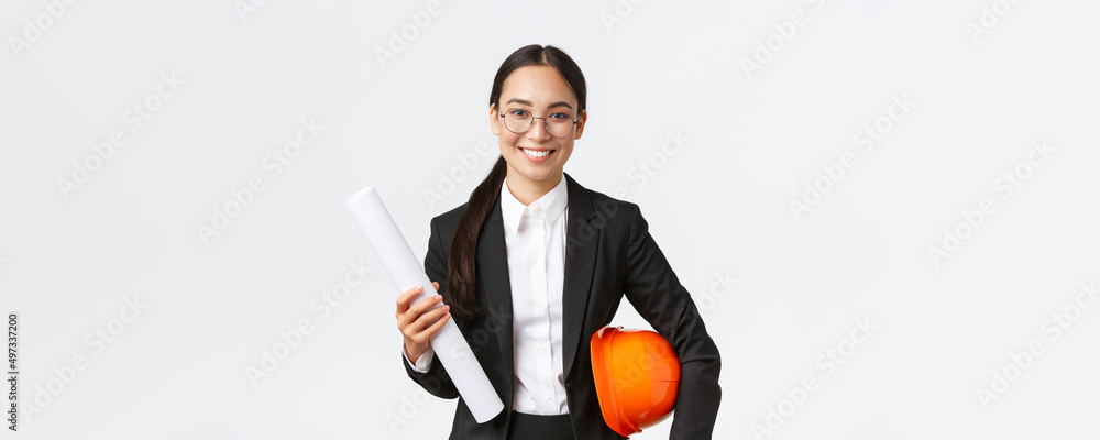 Smiling professional asian female architect in business suit and ...