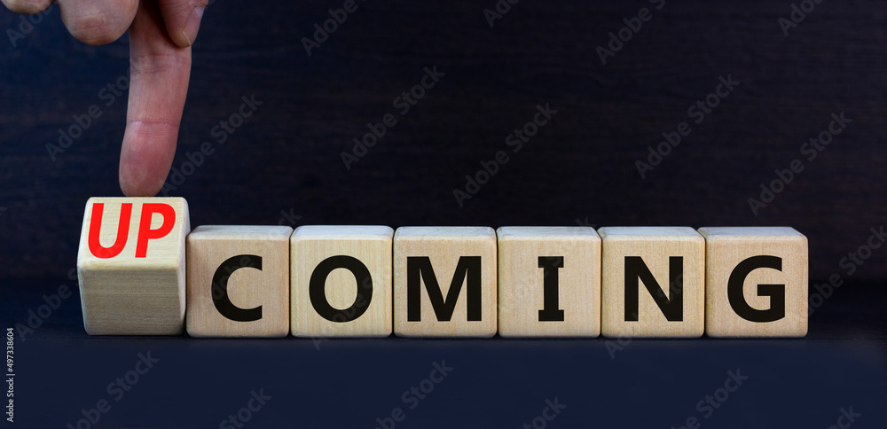 Coming or upcoming symbol. Turned wooden cubes and changed the word ...
