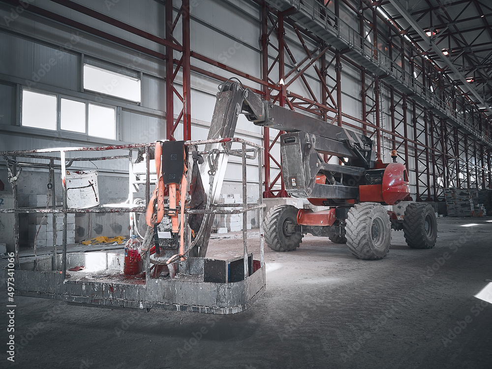 Articulated telescopic elevator. Basket of boom lift picker inside ...