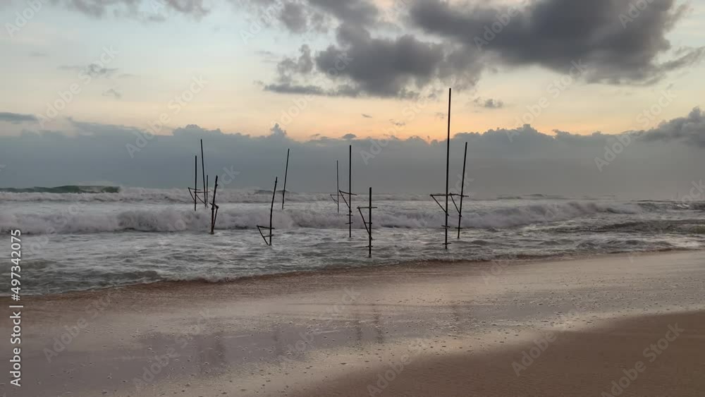 Stilt fishing poles at the beach in Sri Lanka Stock Video | Adobe Stock
