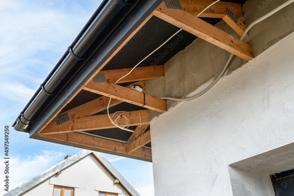 Electric socket mounted on the trusses above the garage door, electric ...
