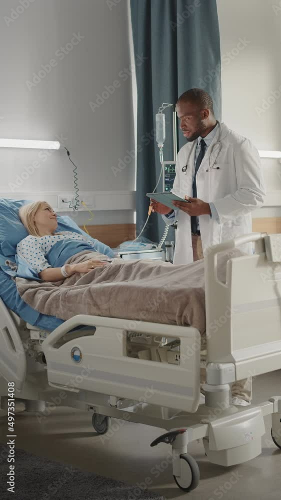 Vertical Screen. Hospital Ward: Black Doctor Talks to Caucasian Female ...