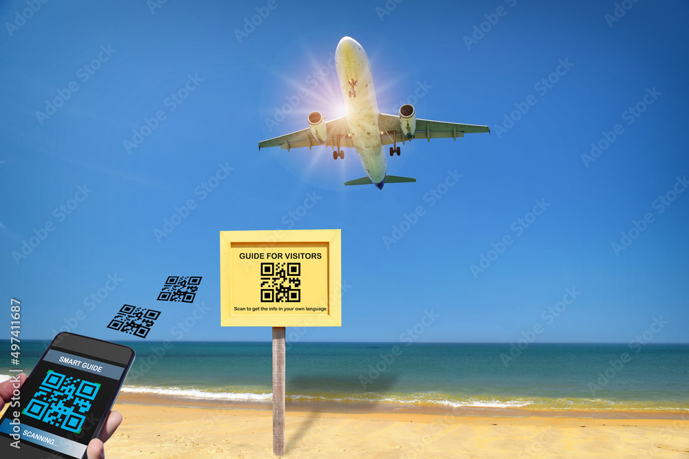 Hand holding smartphone with scanning QR code smart guide screen with ...