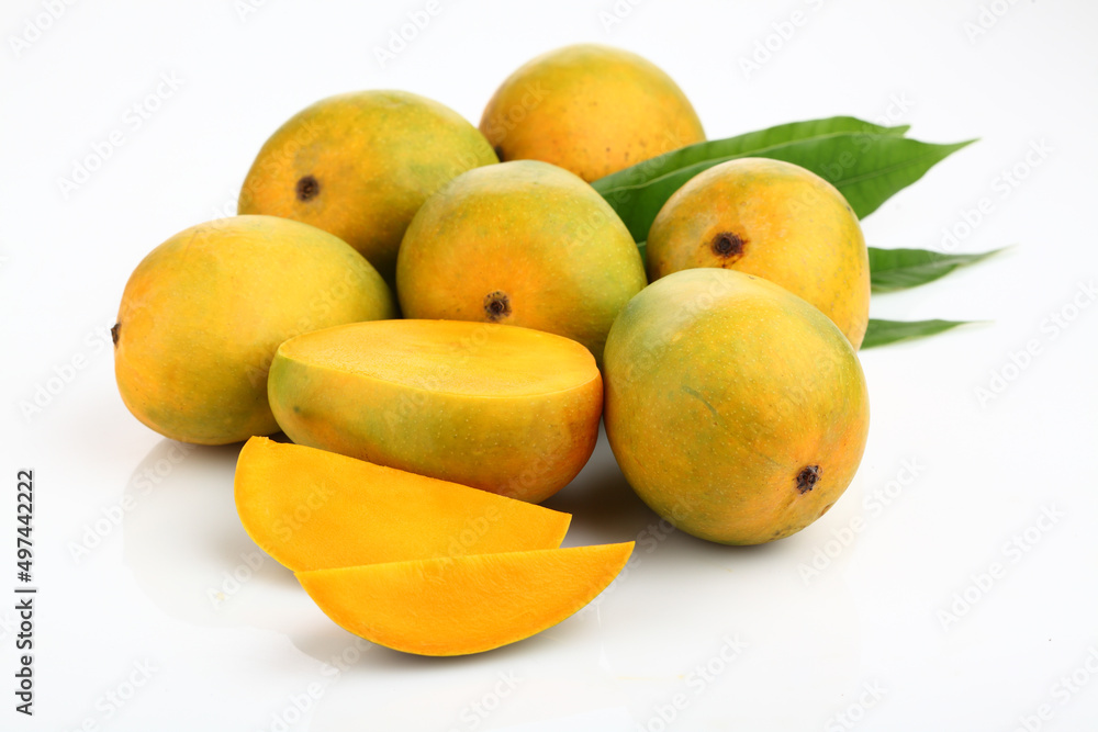 King of fruits; Alphonso Mango fruit with green leaf isolated on white ...