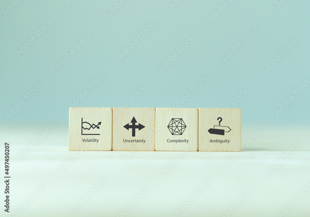 VUCA and strategic management. Wooden cubes with VUCA icon and text ...