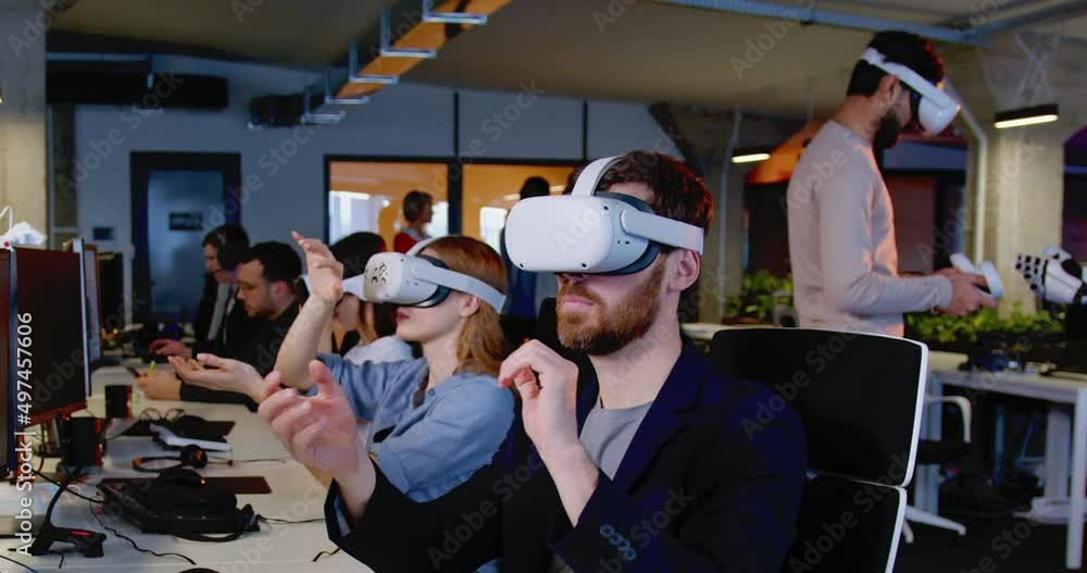 Caucasian man in VR glasses moving hands in air. Male in headset having ...