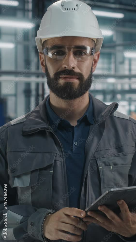 Vertical Footage of Car Factory Engineer in Work Uniform Using Tablet ...