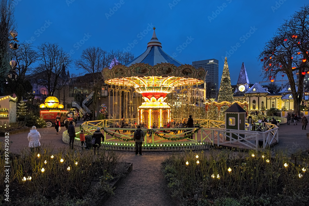 Carousel and Christmas illumination in Tivoli Gardens in evening ...