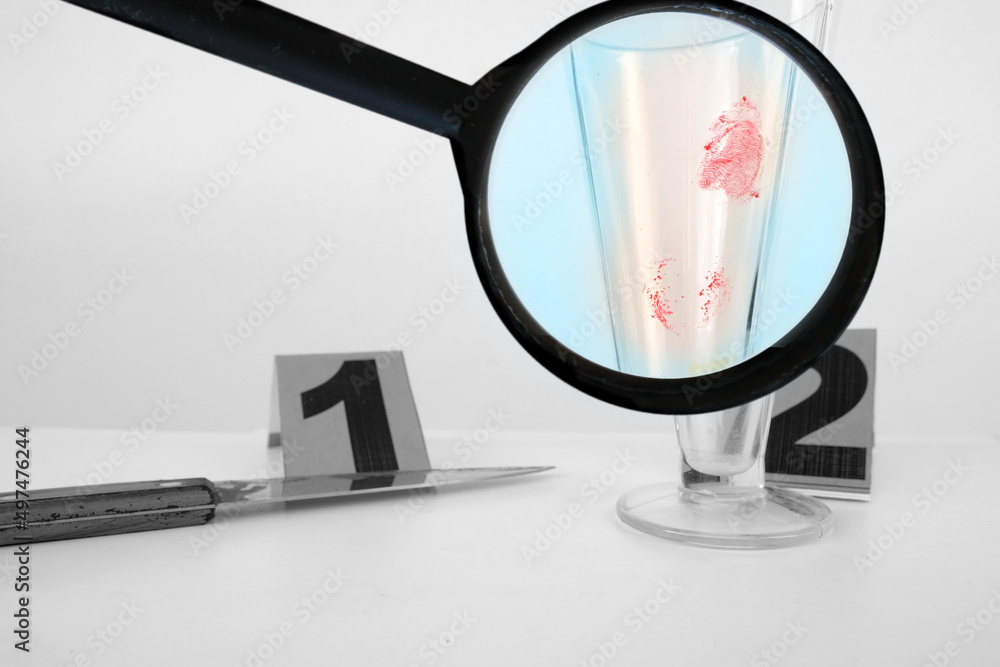 evidence idfresh splatter of red blood on glass goblet, forensic ...