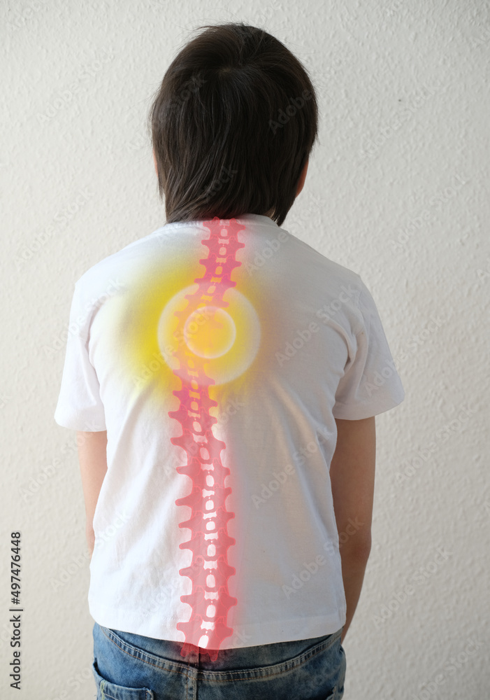 part of naked back of boy, child 10 years old in a white t-shirt ...