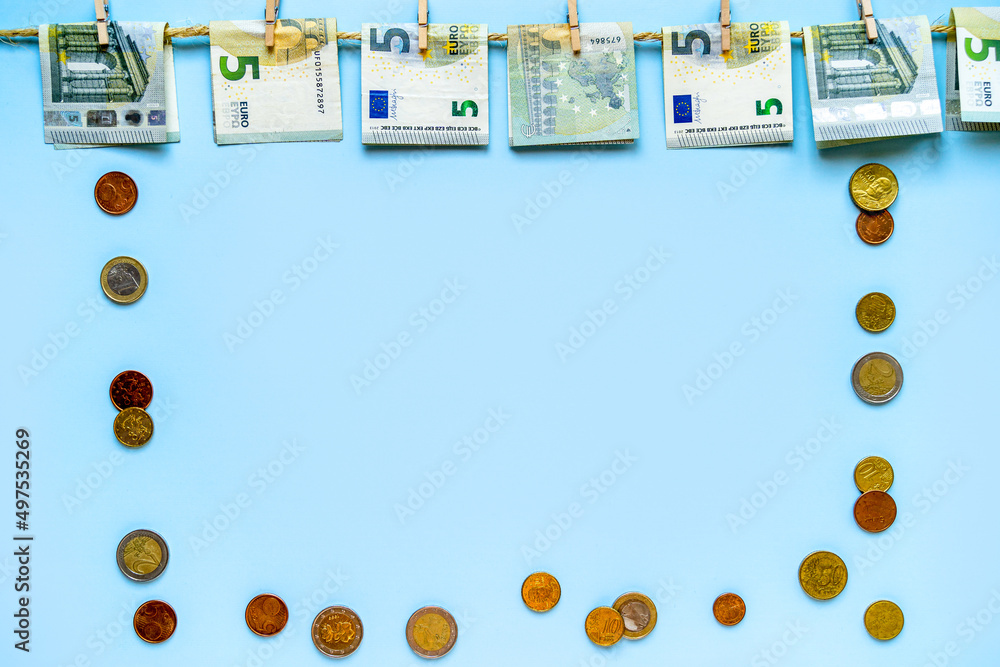 euro money banknotes of five euros and different coins of different ...
