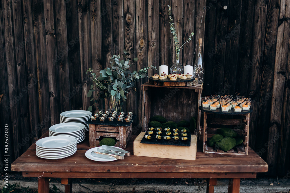 buffet table at a wedding with canapes, fruits and champagne decorated ...