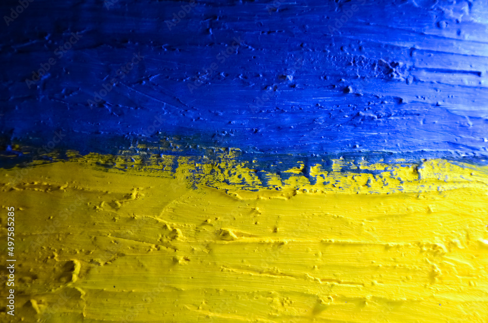 Flag of Ukraine on old grunge wall in background. Grunge brush stroke ...