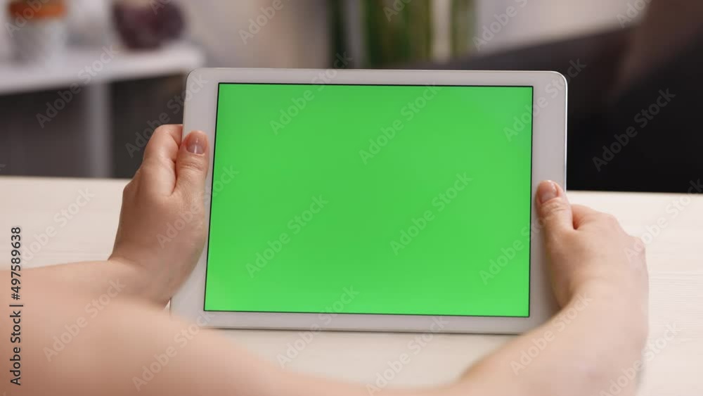 Close up Horizontal hands holding tablet computer with green screen for ...