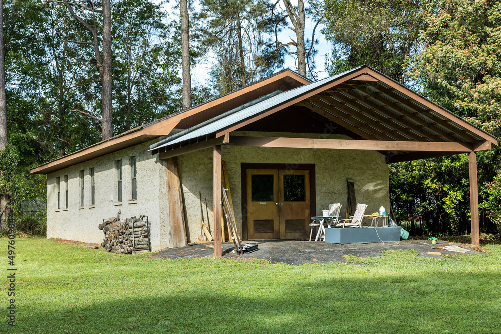Outdoor storage building made of stucco on top of cinder block walls ...