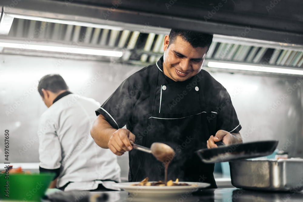 Latin chef preparing nachos Stock Photo | Adobe Stock